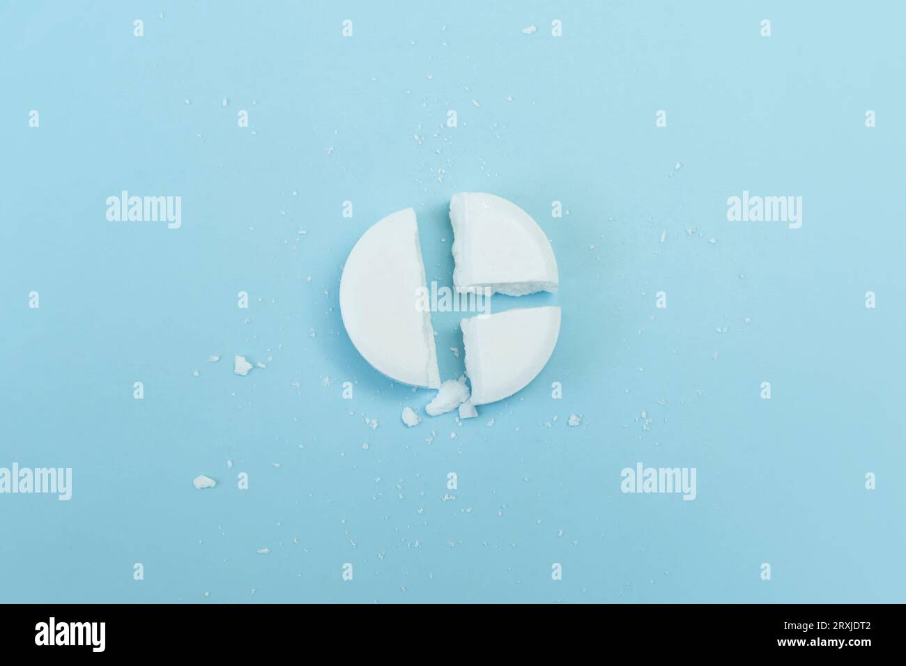 Painkillers and healthcare concept. Top view of white whole and broken ...