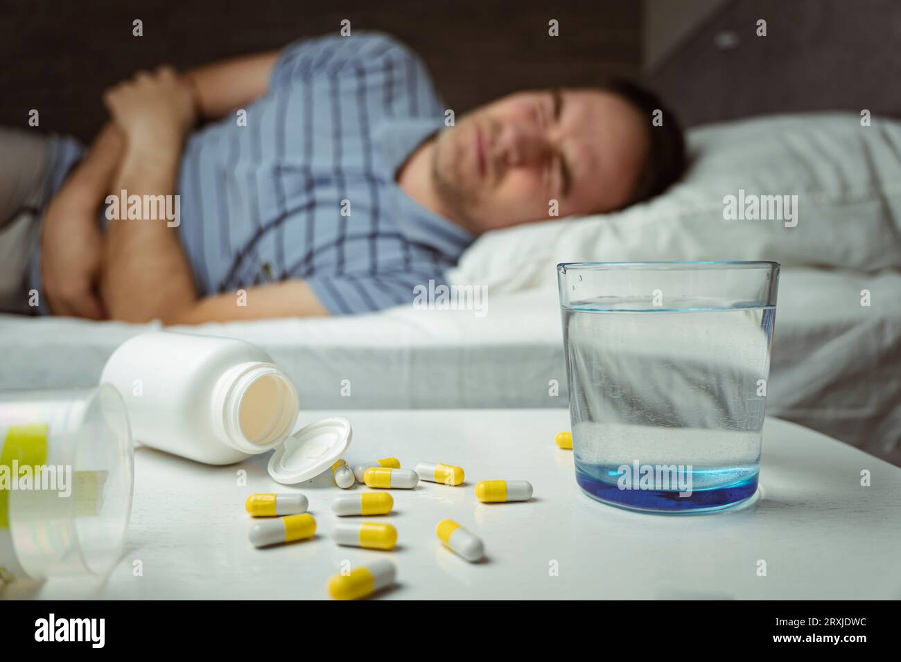 Man stomach ache table hi-res stock photography and images - Alamy
