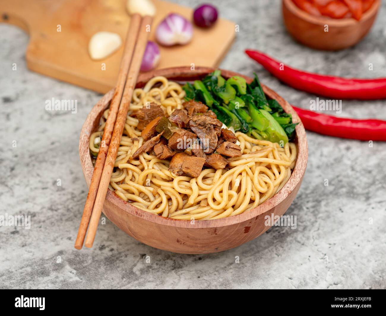 Indonesian chicken noodles called mie ayam topped with chicken meat and ...