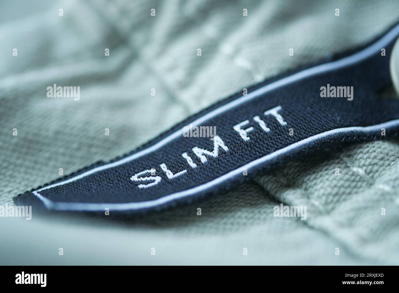 label tag slim fit on a men shirt Stock Photo - Alamy