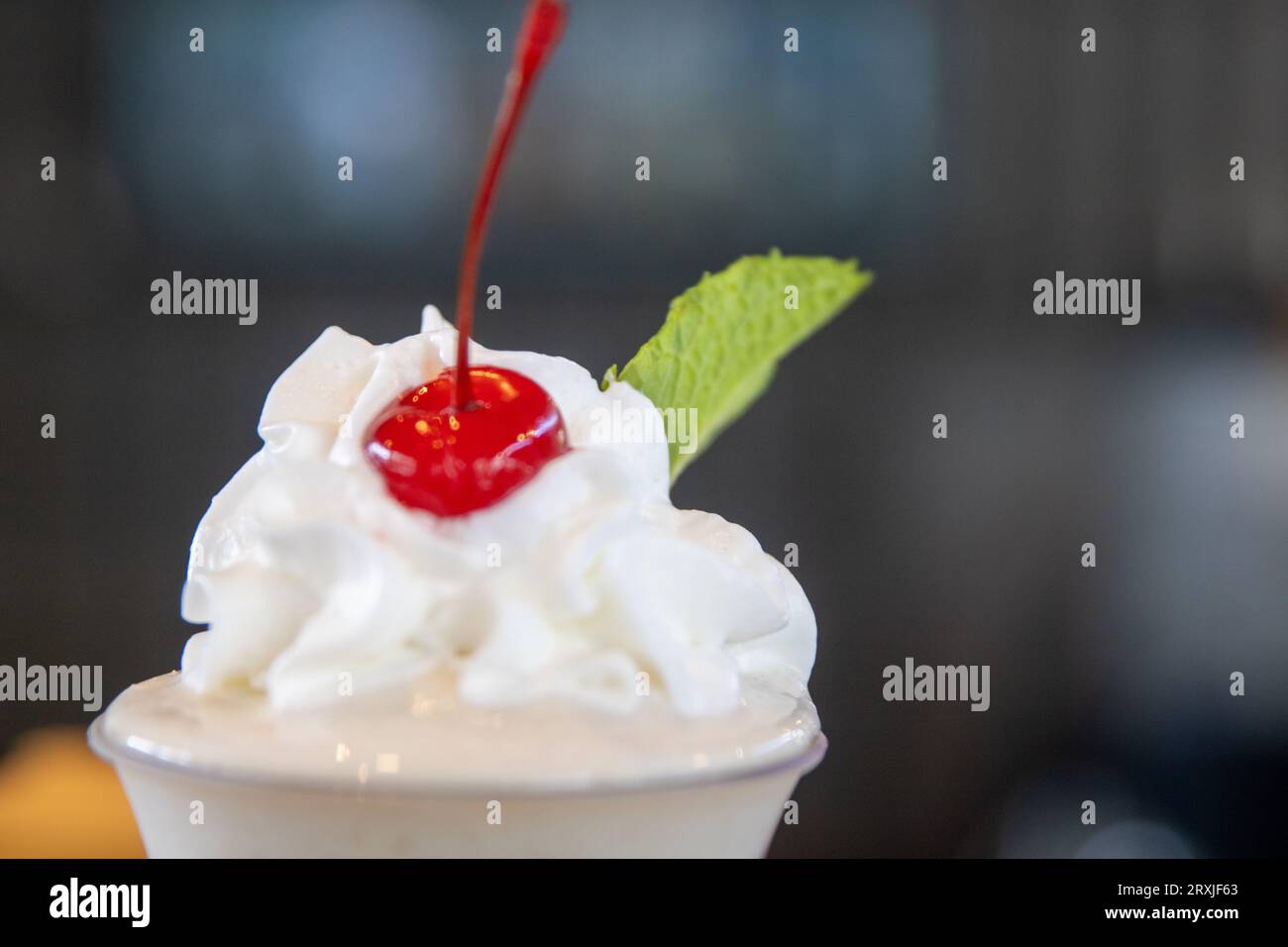 Whipped cream topping with a cherry Stock Photo - Alamy