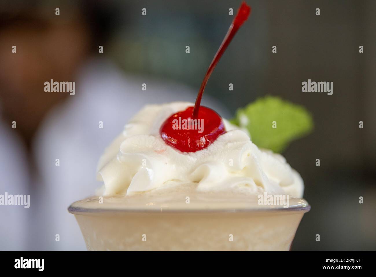 Whipped cream topping with a cherry Stock Photo - Alamy