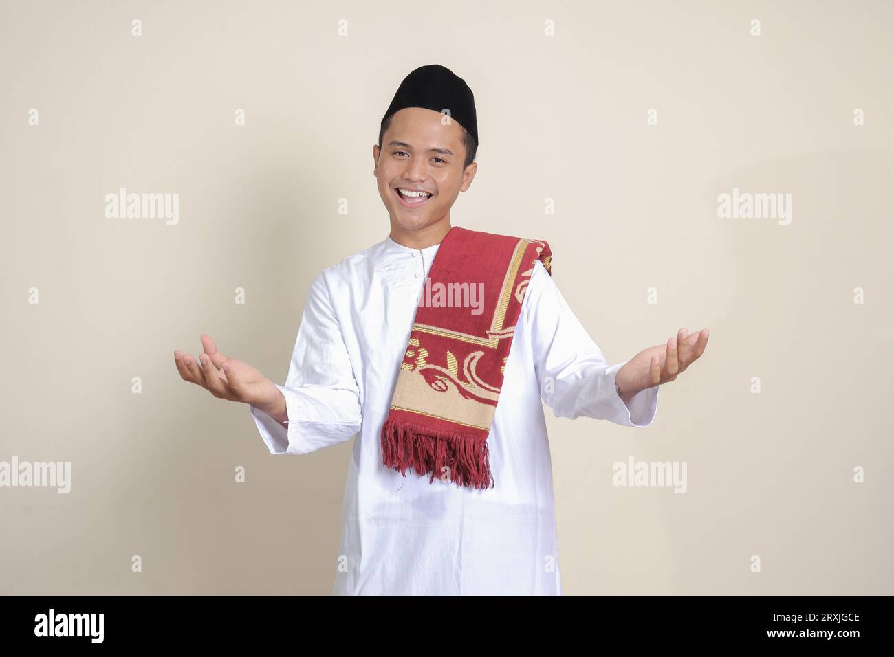Portrait of attractive Asian muslim man in white shirt pulling hands ...