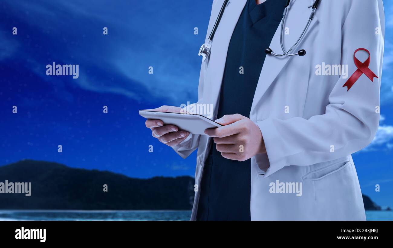 Female doctor with stethoscope using a tablet. World Aids Day concept ...