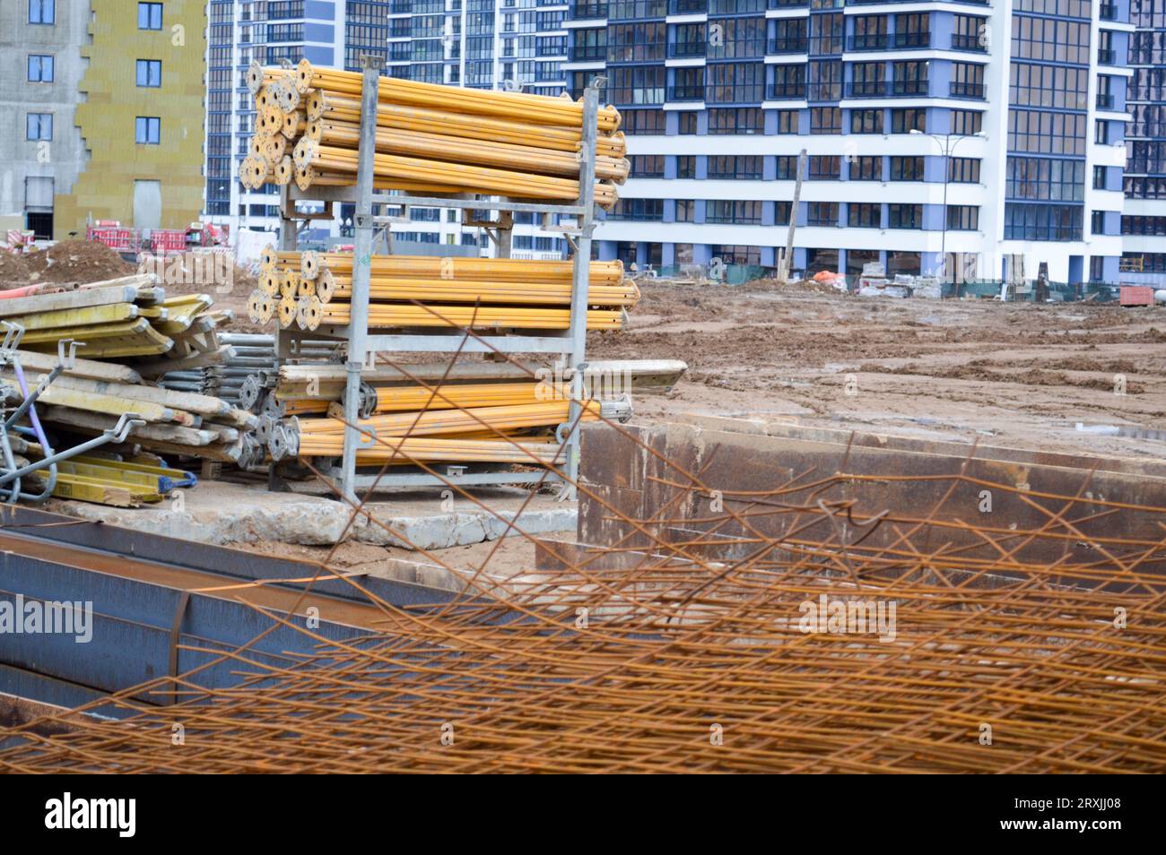 A lot of building materials with metal spare parts, sticks, beams ...