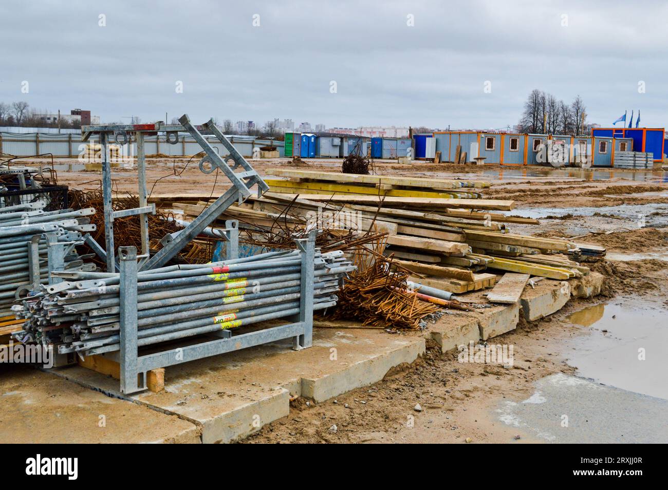 A lot of building materials with metal spare parts, sticks, beams ...