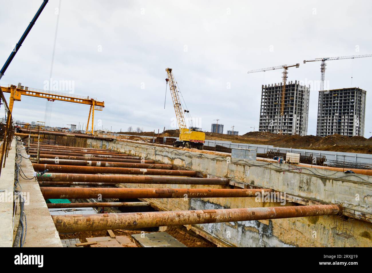 A construction site with specialized professional equipment and cranes ...