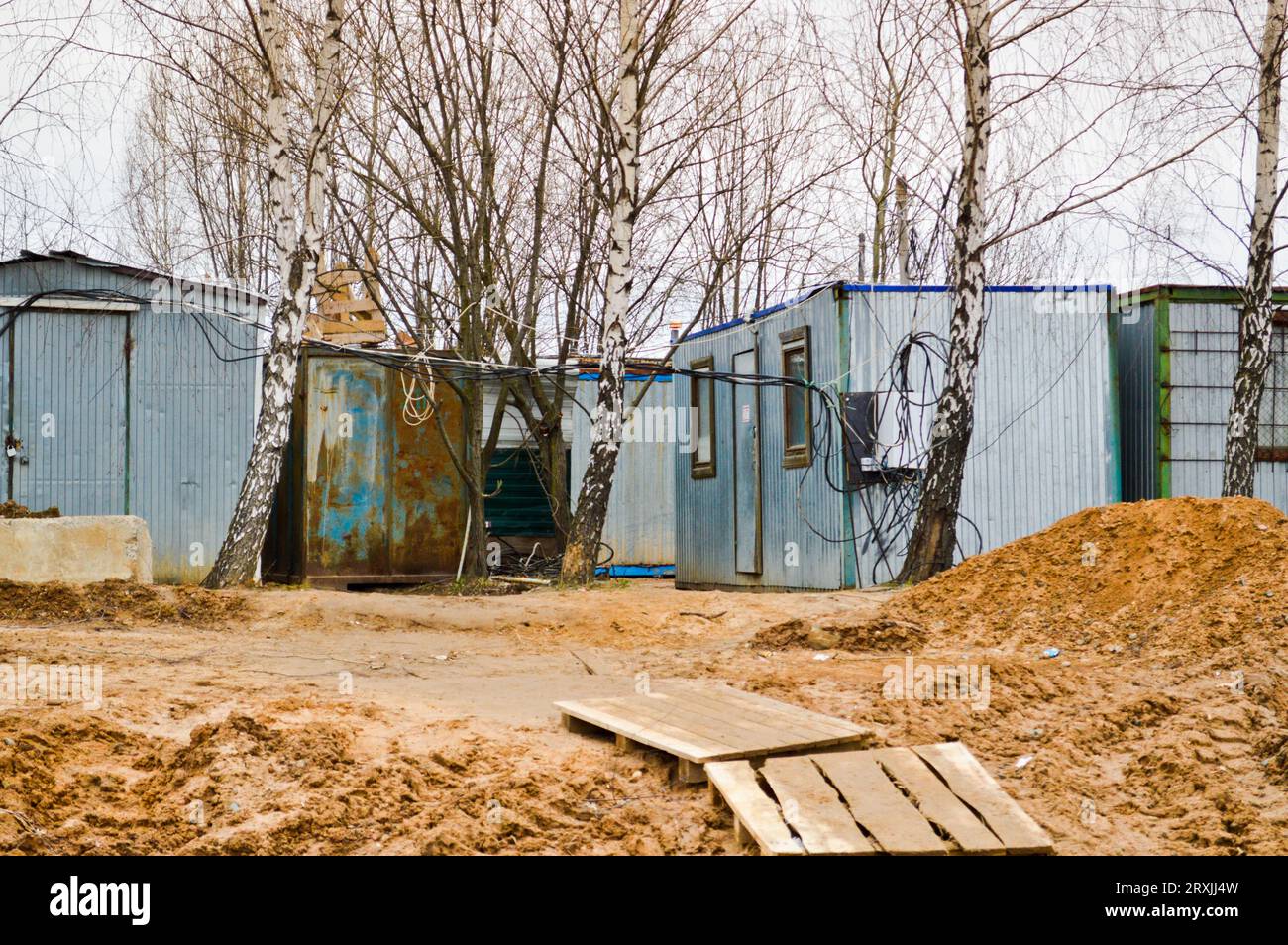 Small temporary houses of builders from containers at an industrial ...