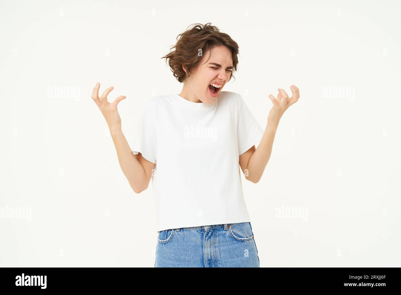 Portrait of woman throwing tantrum, shouting and screaming, shaking ...