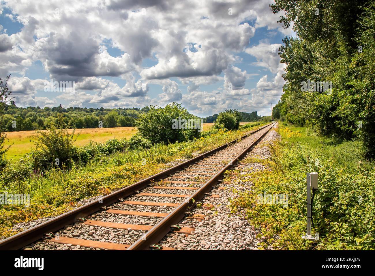 Single track railway line running through English countryside, Bourne ...