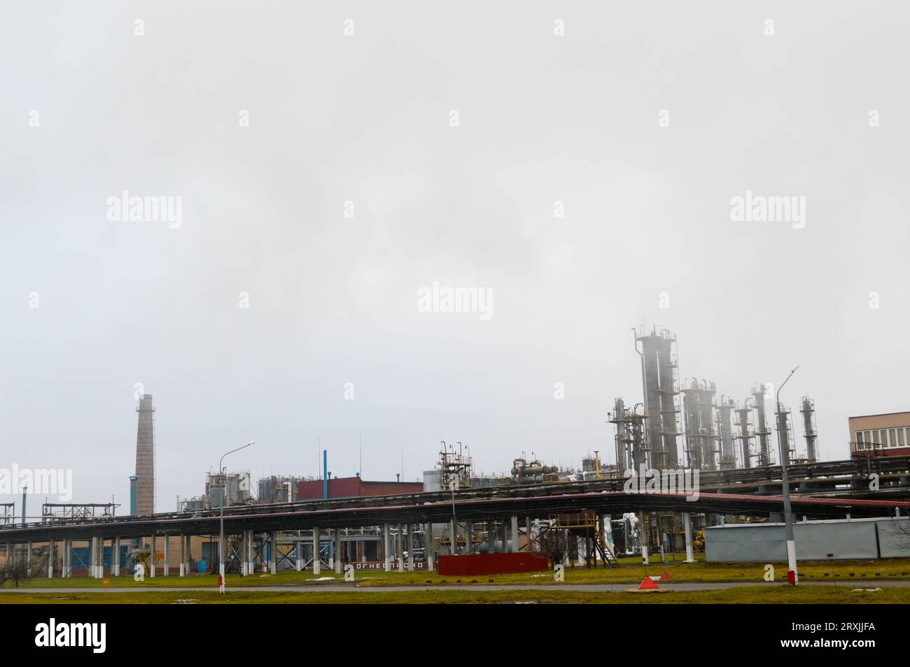 Oil refinery, petrochemical plant, in cloudy weather, fog Stock Photo ...