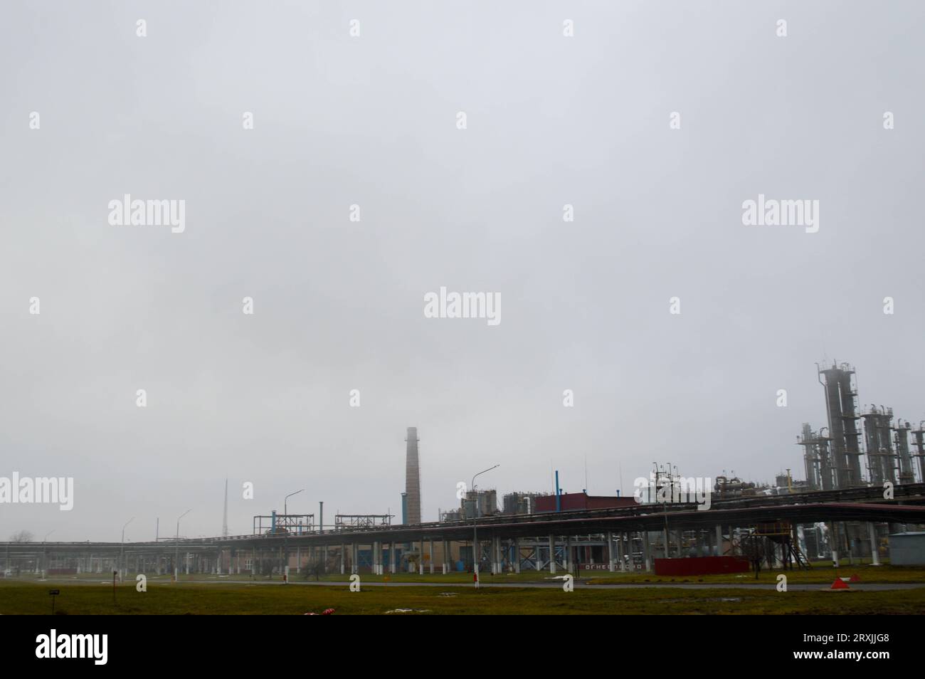 Oil refinery, petrochemical plant, in cloudy weather, fog Stock Photo ...