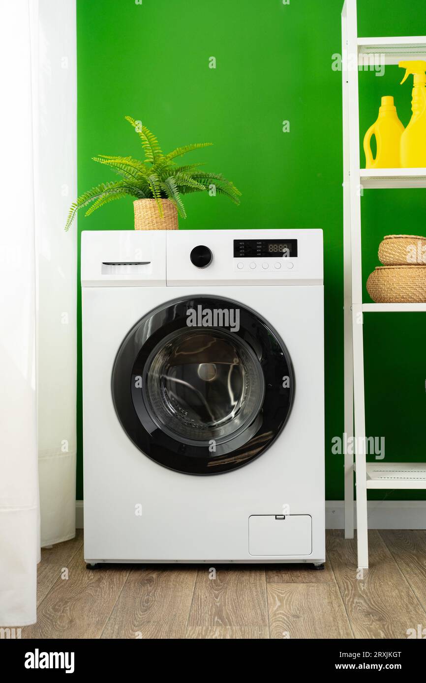 Modern white washing machine close up photo Stock Photo - Alamy