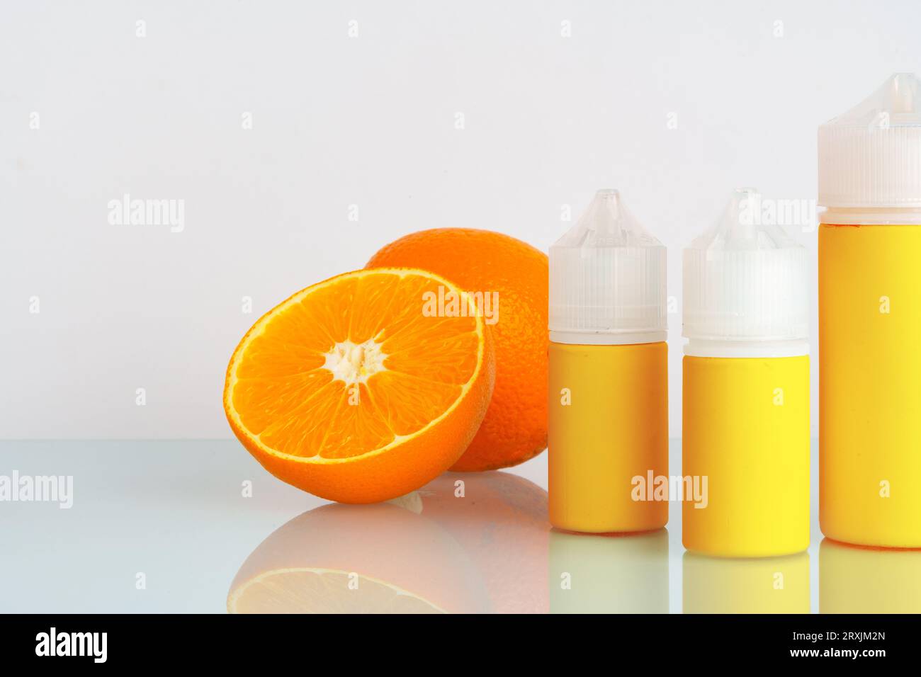 Vape liquid with orange flavor on white background Stock Photo - Alamy