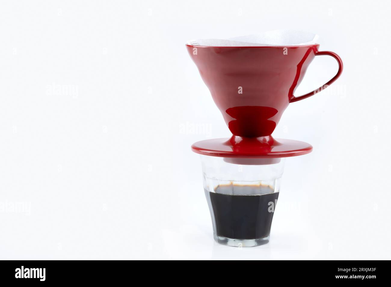 Cup of coffee with a V60 dripper coffee maker isolated over a white ...
