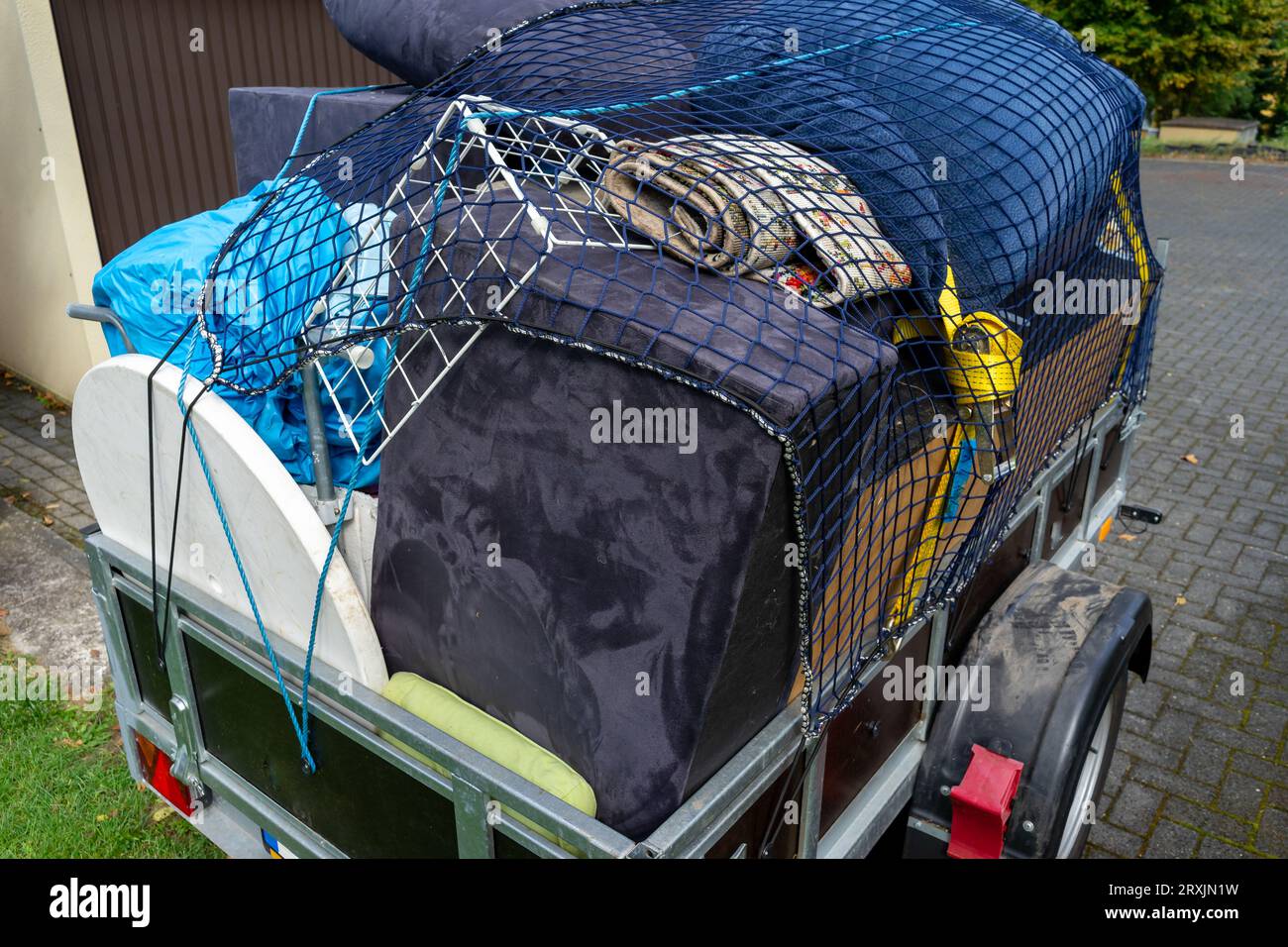 Bulky waste on a trailer after a house clearance Stock Photo - Alamy