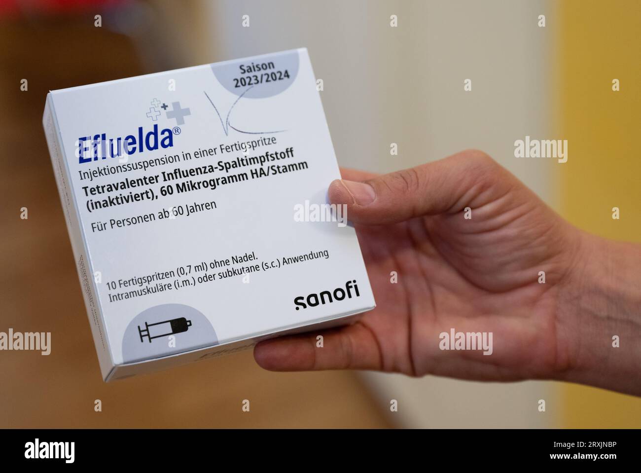 Munich, Germany. 26th Sep, 2023. A staff member shows Sanofi's Efluelda influenza vaccine for ...