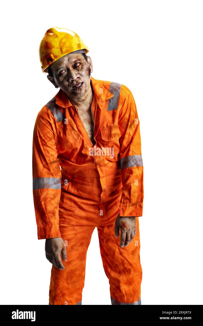 A scary construction worker zombie with blood and wounds on his body ...