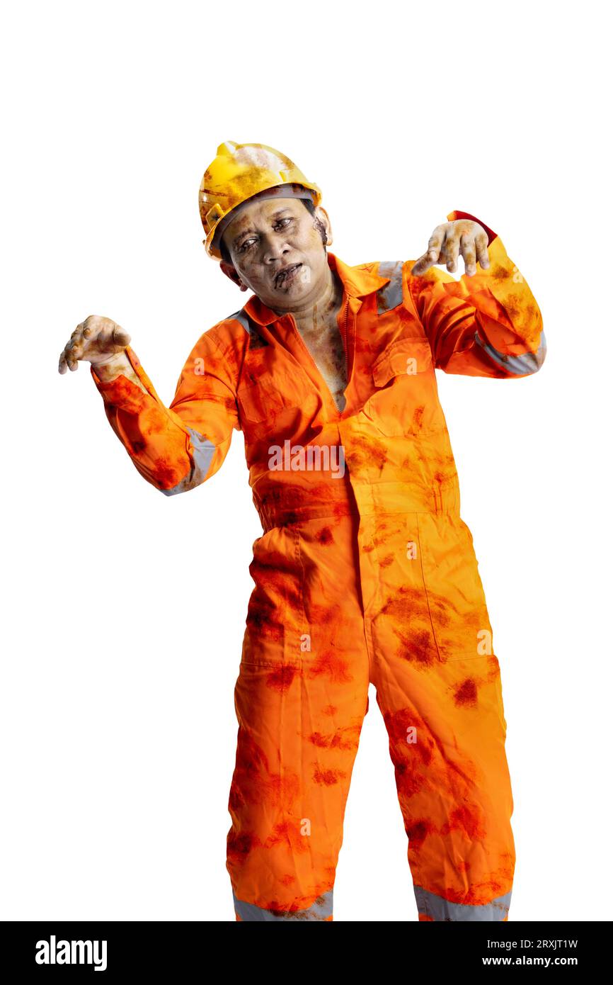 A scary construction worker zombie with blood and wounds on his body ...