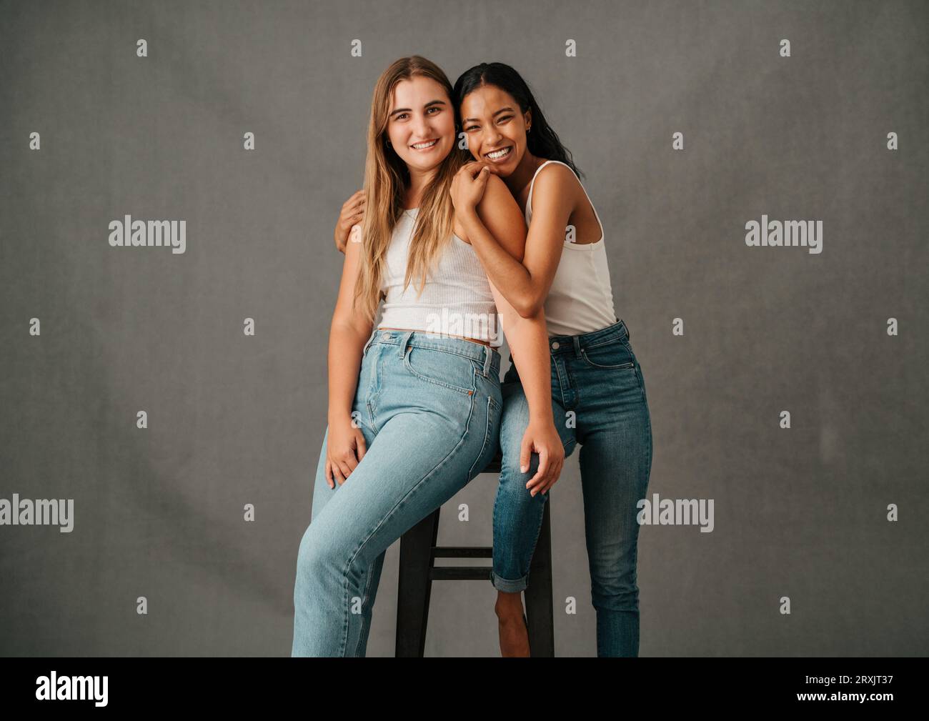 Two girls happily hugging hi-res stock photography and images - Alamy