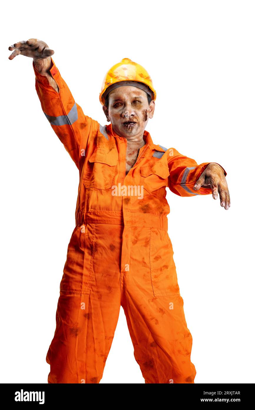 A scary construction worker zombie with blood and wounds on his body ...