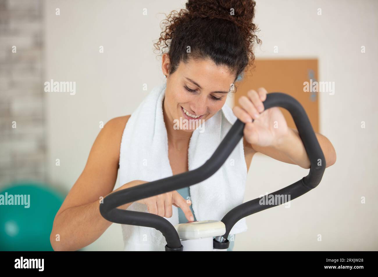Woman programming exercise machine hi-res stock photography and images ...