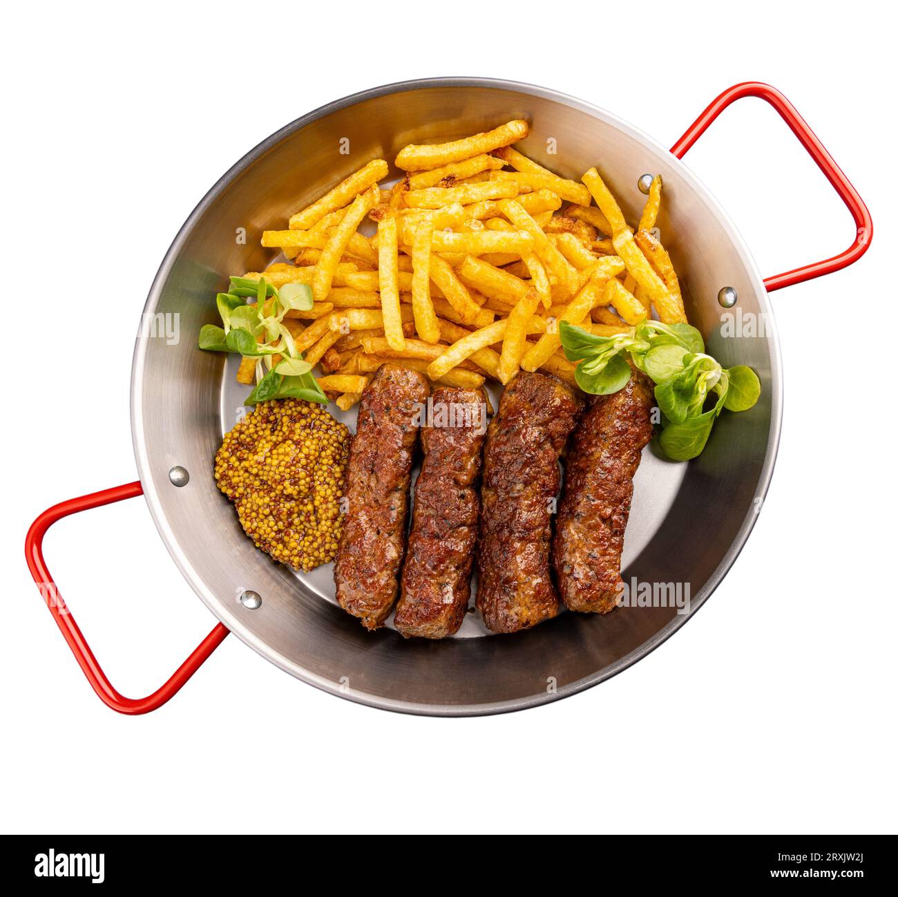 Grilled Romanian meat rolls called mititei or mici served with fries ...