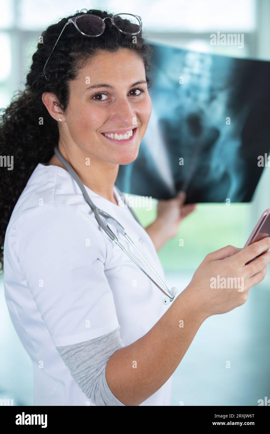 female doctor radiologist holding an xray and smiling at camera Stock ...