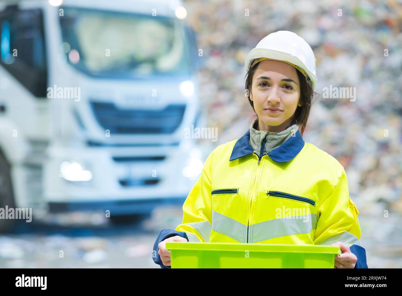 Carrying recycling bin hi-res stock photography and images - Alamy