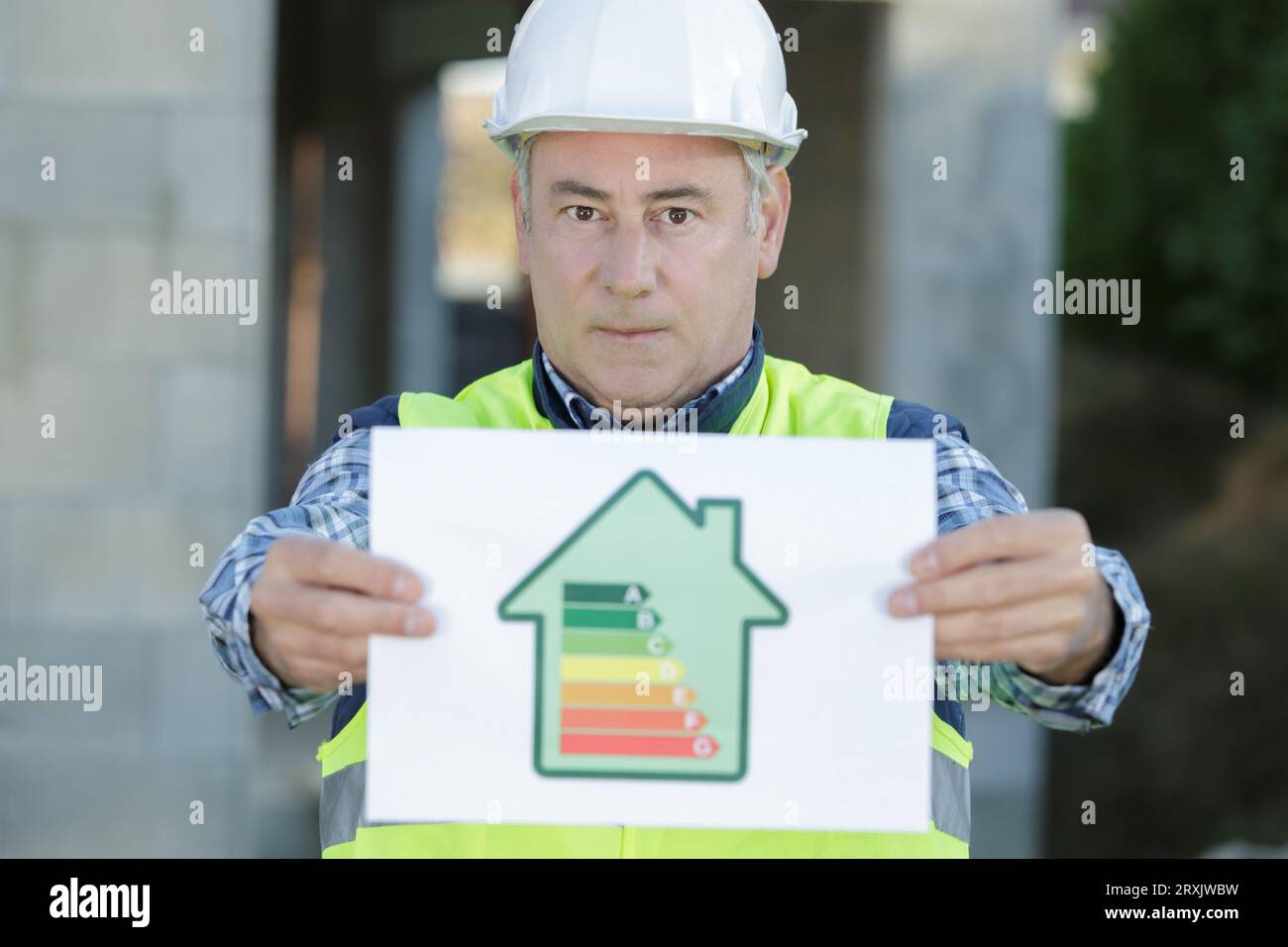 an electrician showing energy class chart Stock Photo - Alamy