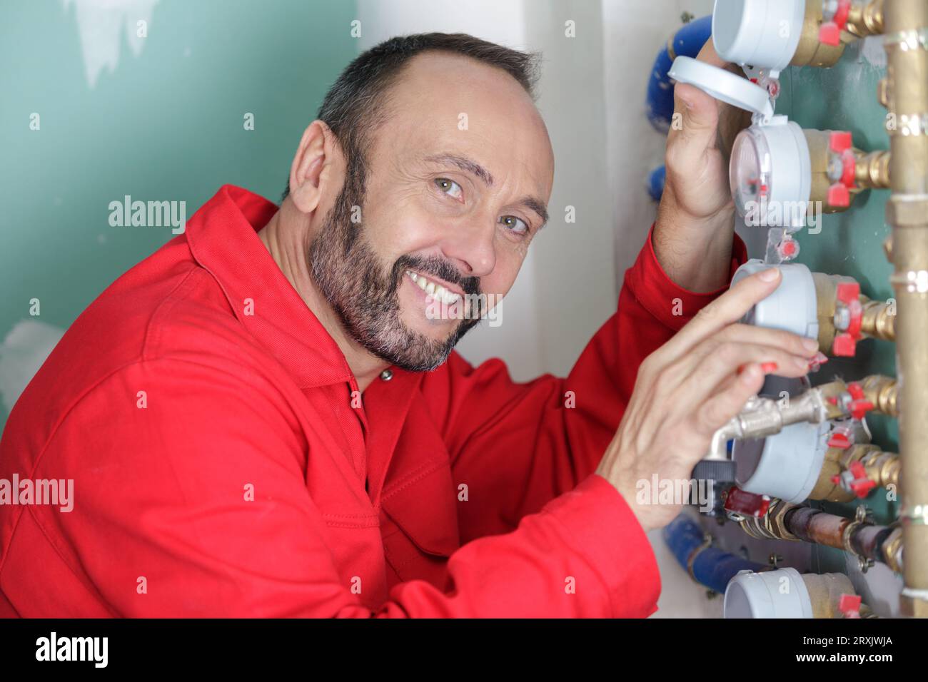 a man working with water valve Stock Photo - Alamy