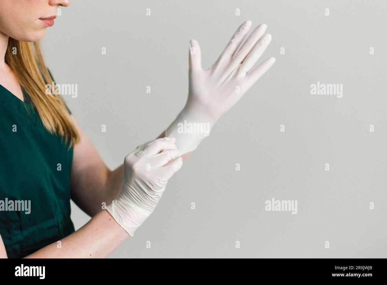 Female doctor wearing rubber gloves Stock Photo - Alamy