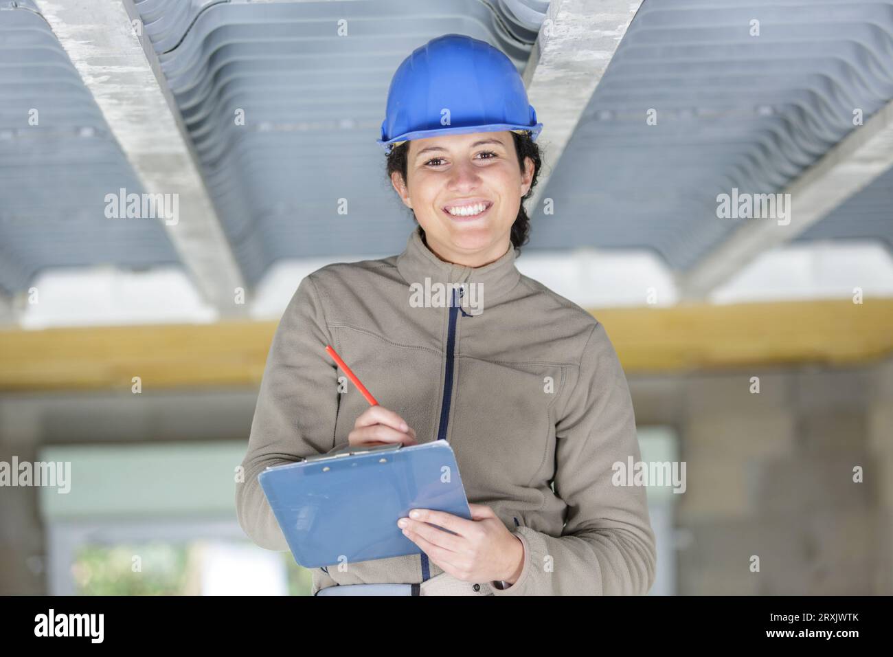 female construction worker taking notes at the construction site Stock ...