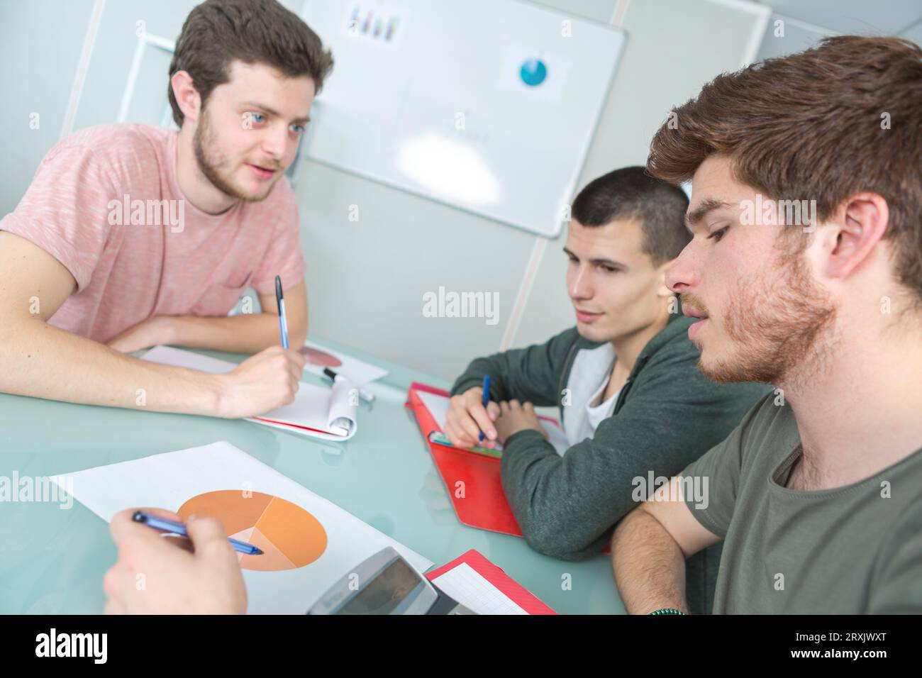 happy learners listening to teacher at lesson Stock Photo - Alamy