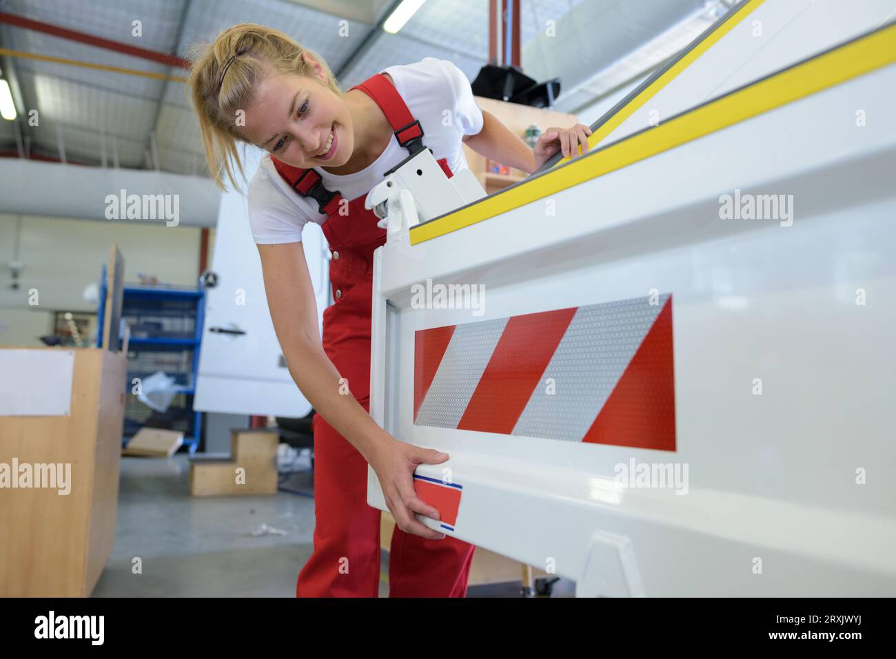 female worker at a garage Stock Photo - Alamy