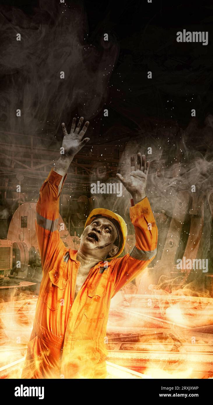 A scary construction worker zombie with blood and wounds on his body is ...