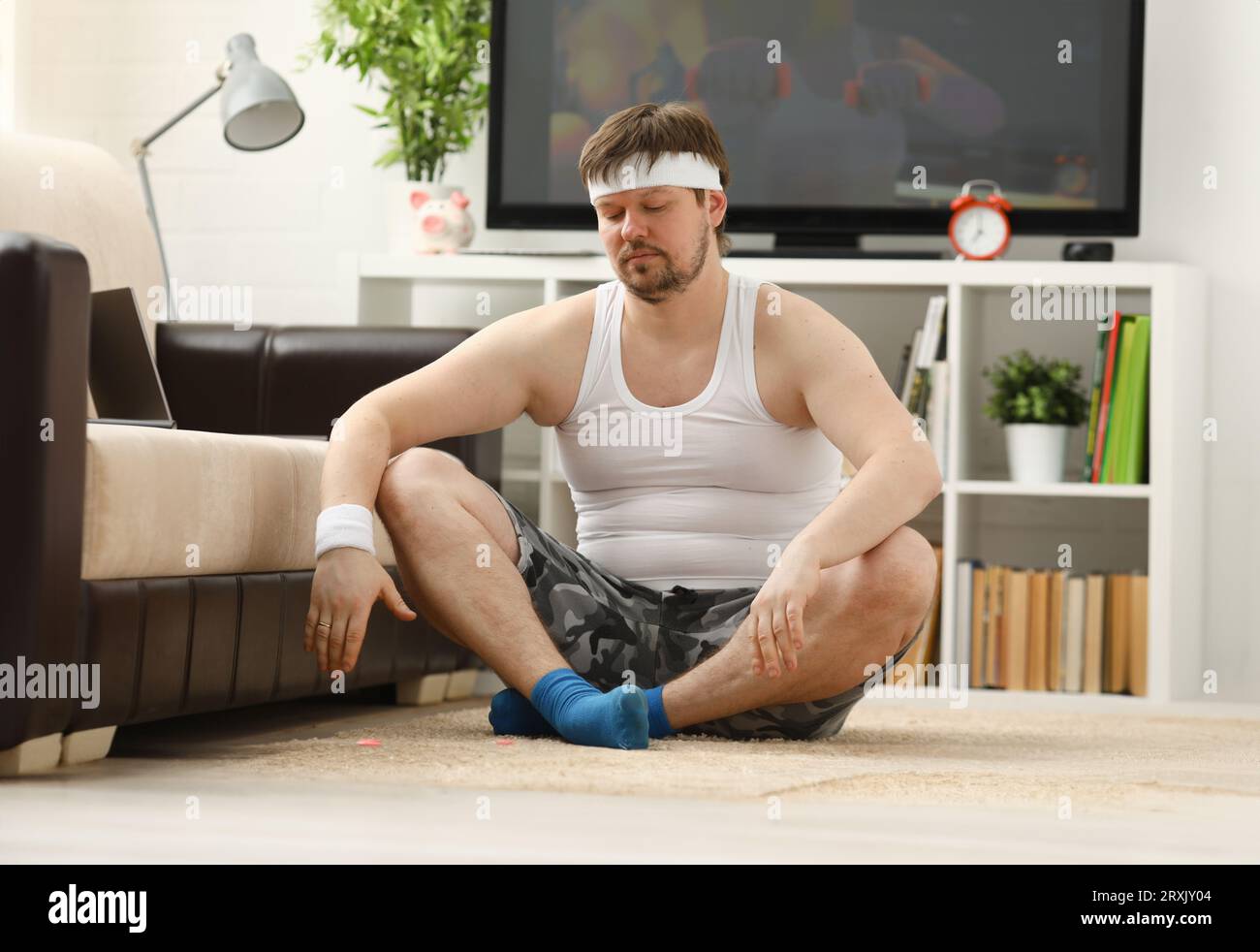 Young attractive fitness man lies on a fat mat with Stock Photo - Alamy