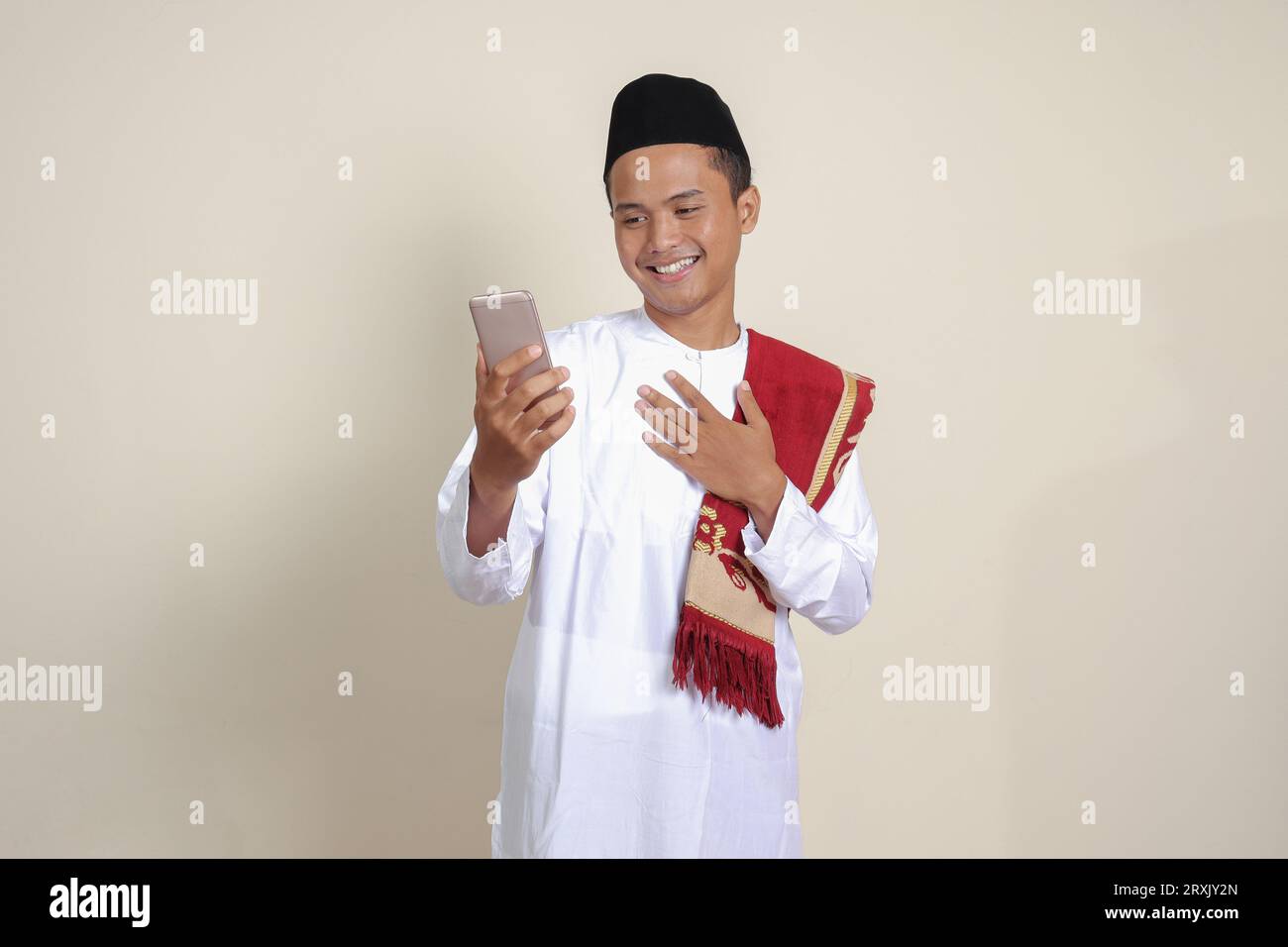 Portrait of attractive Asian muslim man in white shirt taking picture ...