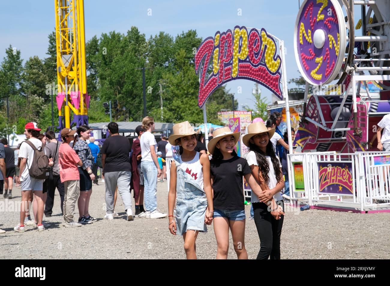 day off people in Vancouver buy drinks ride on swings rides wear cowboy ...