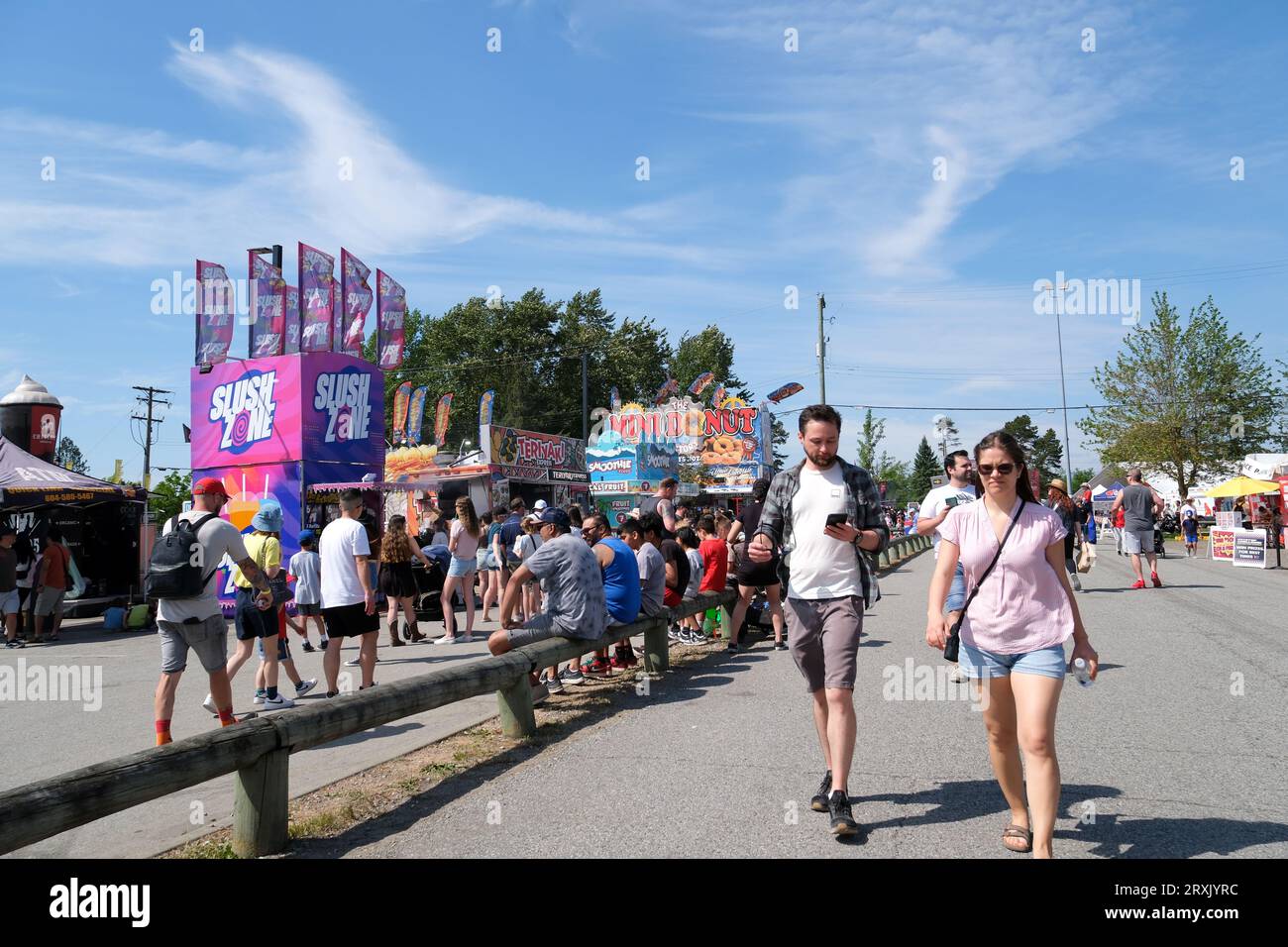 day off people in Vancouver buy drinks ride on swings rides wear cowboy ...
