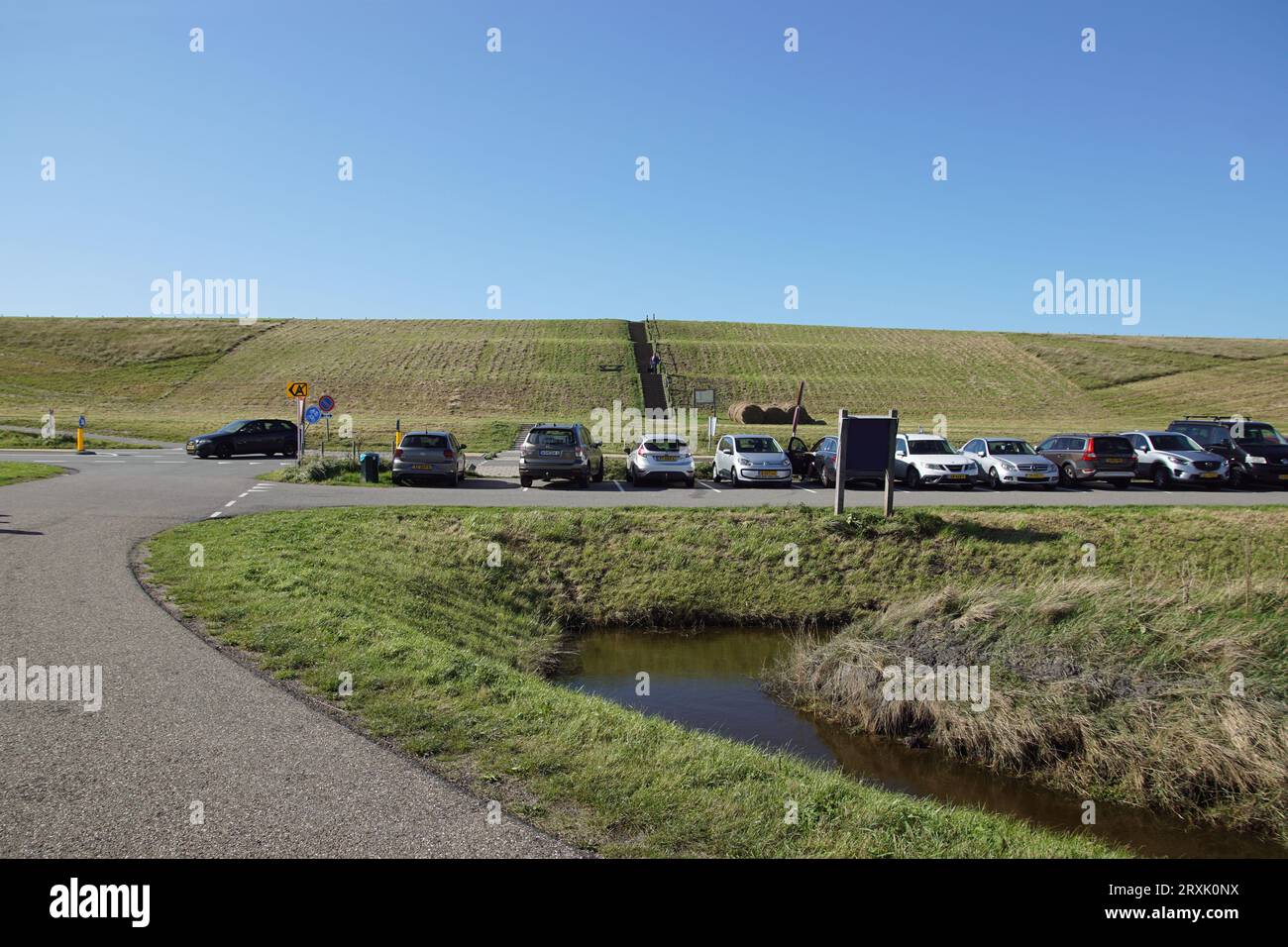 Stairs on Dutch dyke, seawall, gras as protection against the North Sea ...