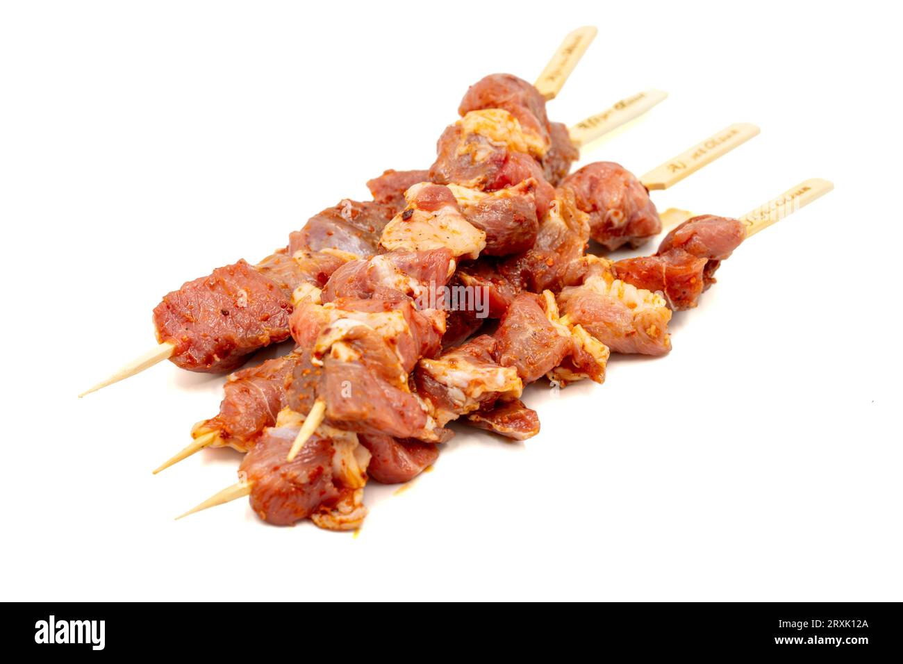 Lamb skewers isolated on white background. Raw lamb skewer with herbs ...