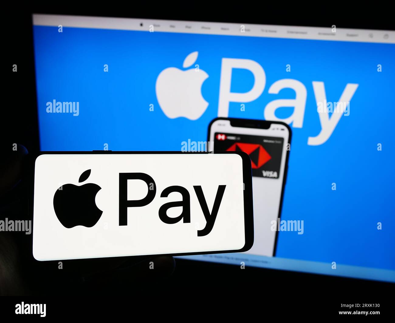 Person holding smartphone with logo of mobile payment service Apple Pay ...