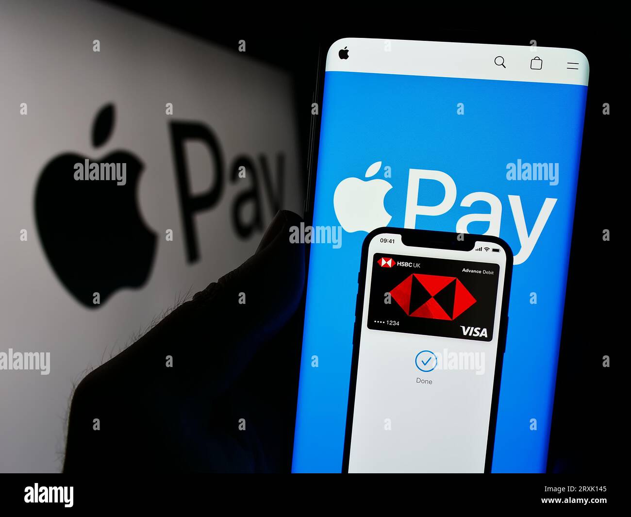 Person holding smartphone with website of mobile payment service Apple ...