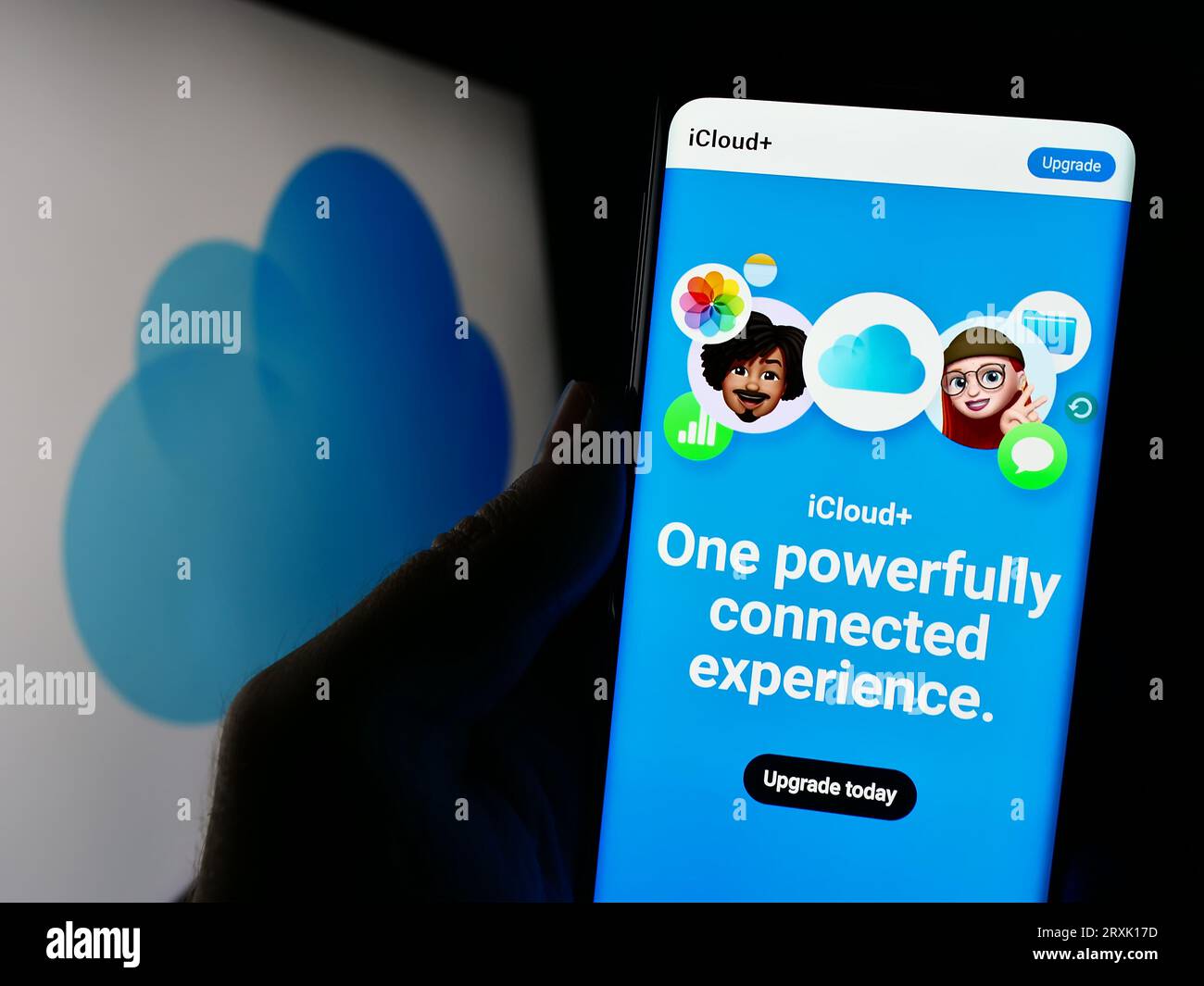 Person holding mobile phone with web page of cloud storage platform ...