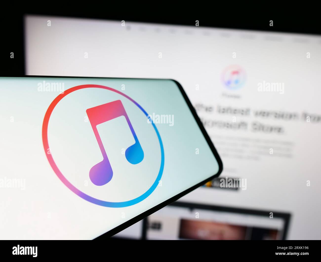 Mobile phone with logo of media software program Apple iTunes on screen ...