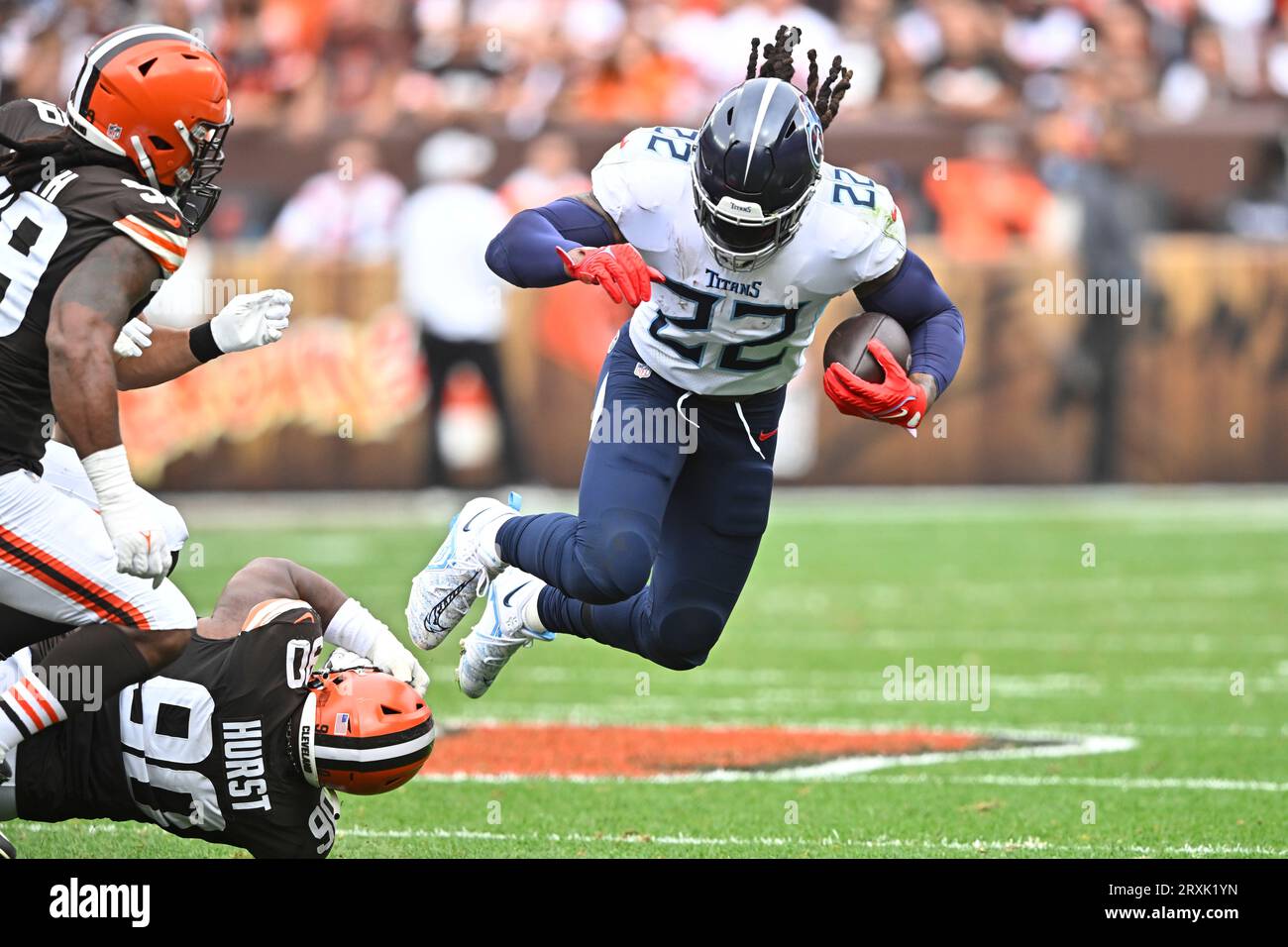 Tennessee Titans running back Derrick Henry (22) is tripped up by ...