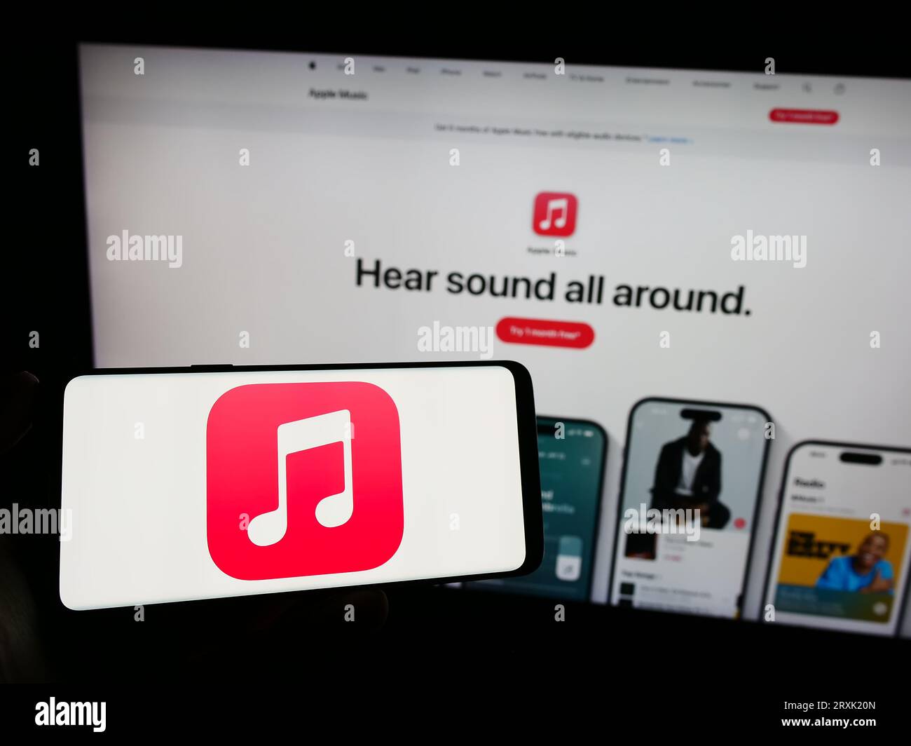 Person holding mobile phone with logo of streaming service platform ...