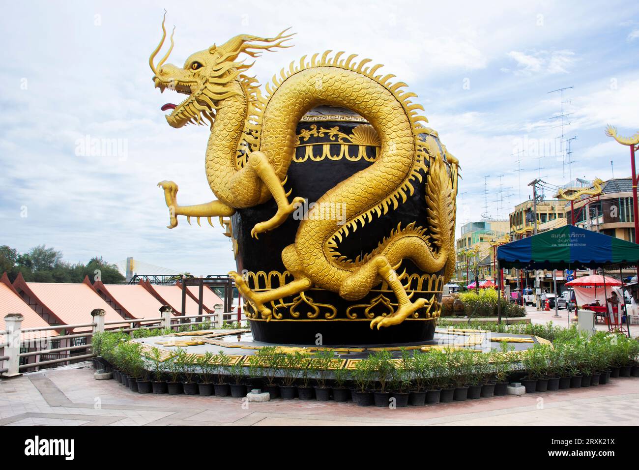 Art symbol of Rat Buri city glazed water jar and sculpture carving gold ...