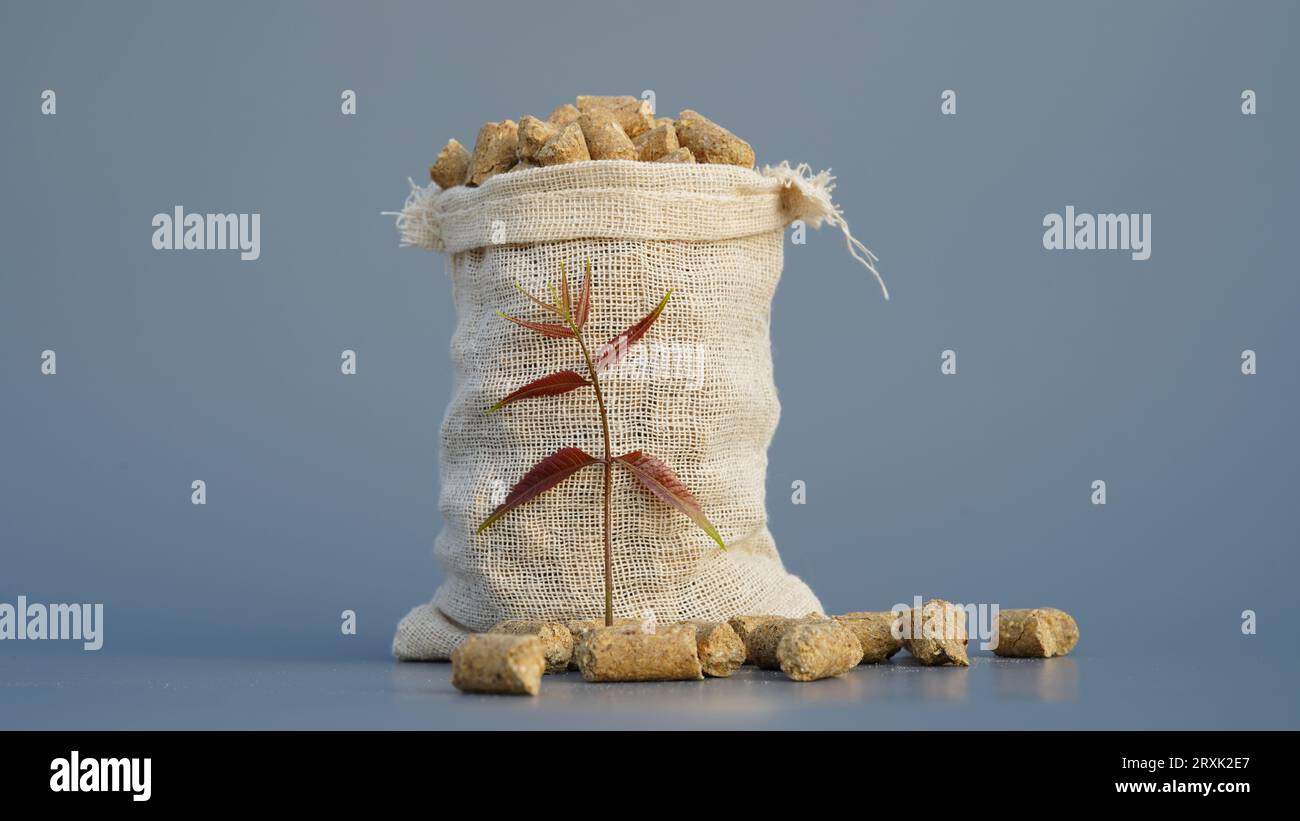 Burlap or jute bag of granulated chicken feed isolated on gray ...